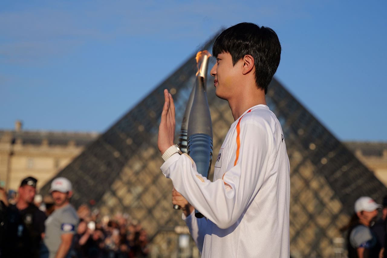BTS Jin Carries the Olympic Torch in Paris, Enthralling Fans