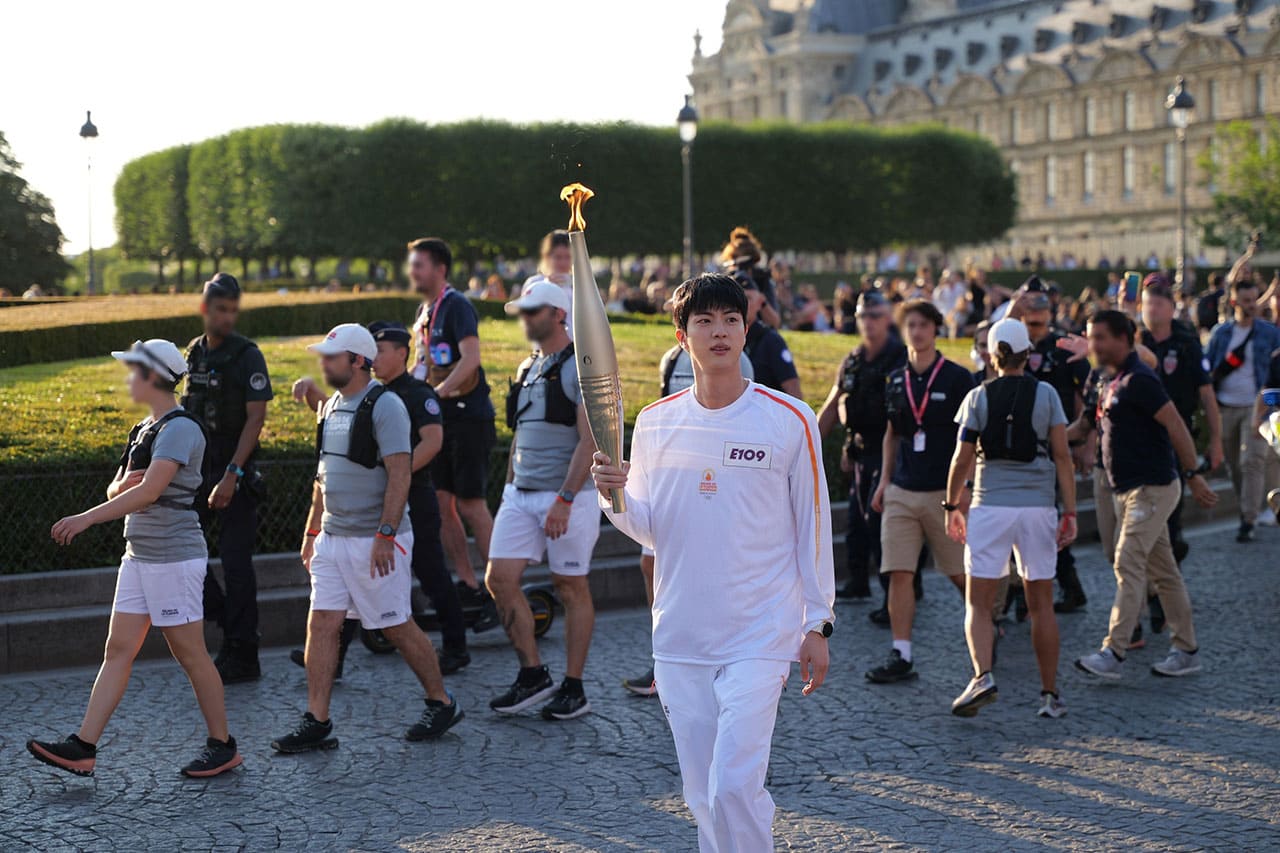 BTS Jin Carries the Olympic Torch in Paris, Enthralling Fans