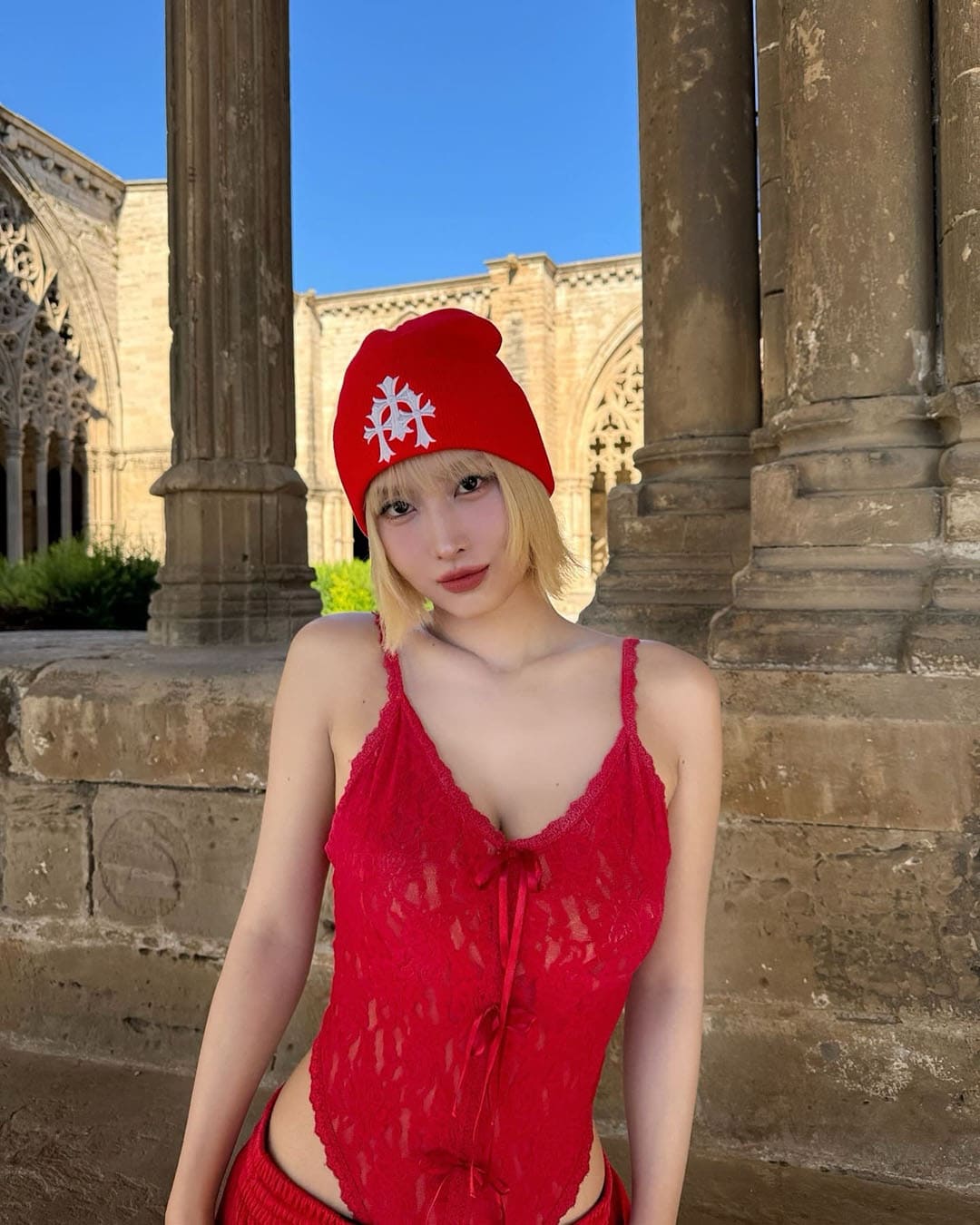 TWICE Momo Stuns in Bold Red Sheer Look, Showcasing Her Unique Style