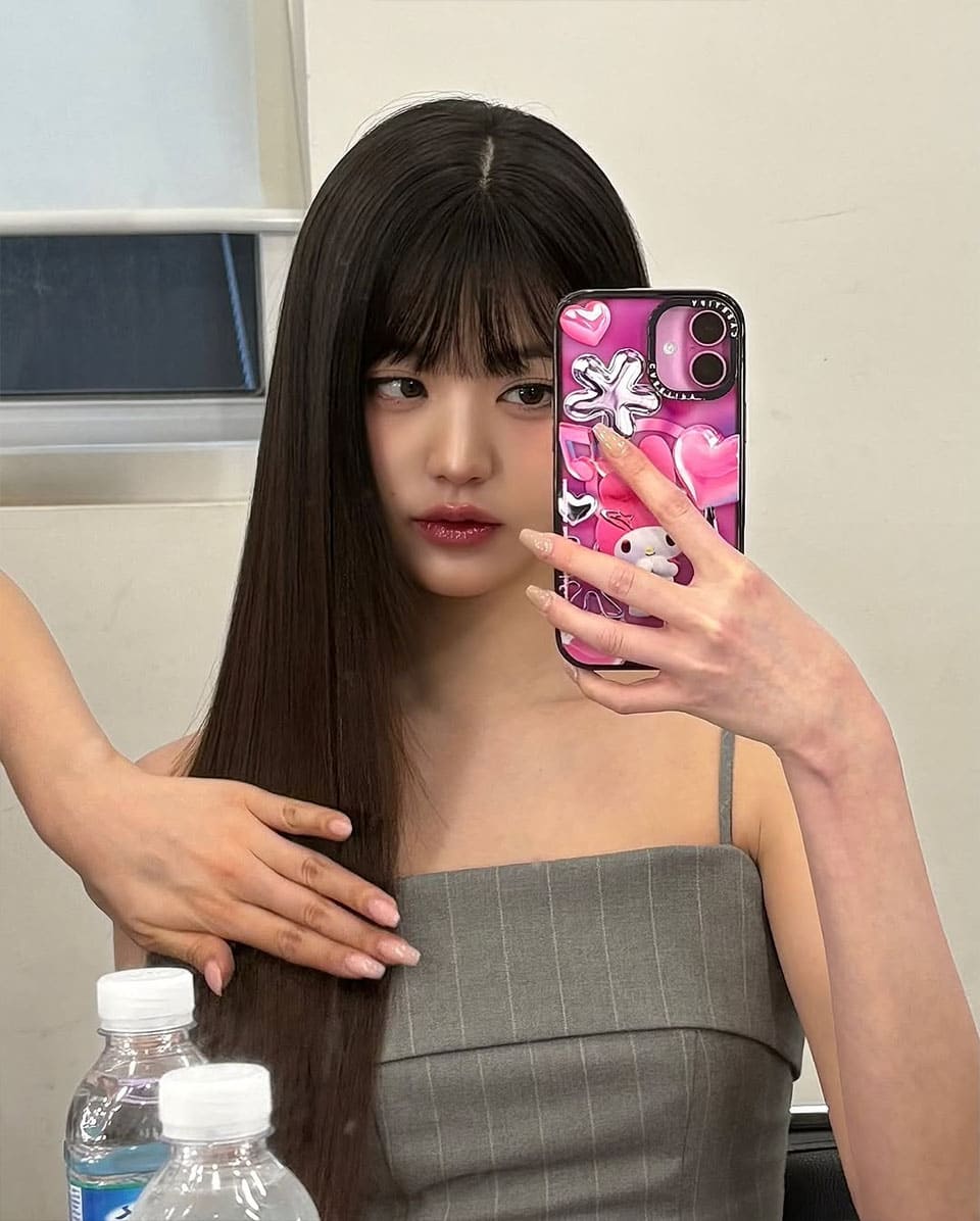 IVE’s Jang Won-young Charms with Signature Wink and Doll-Like Beauty