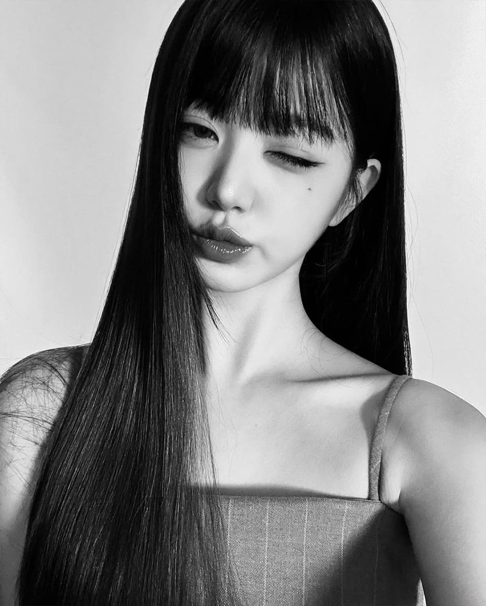 IVE’s Jang Won-young Charms with Signature Wink and Doll-Like Beauty